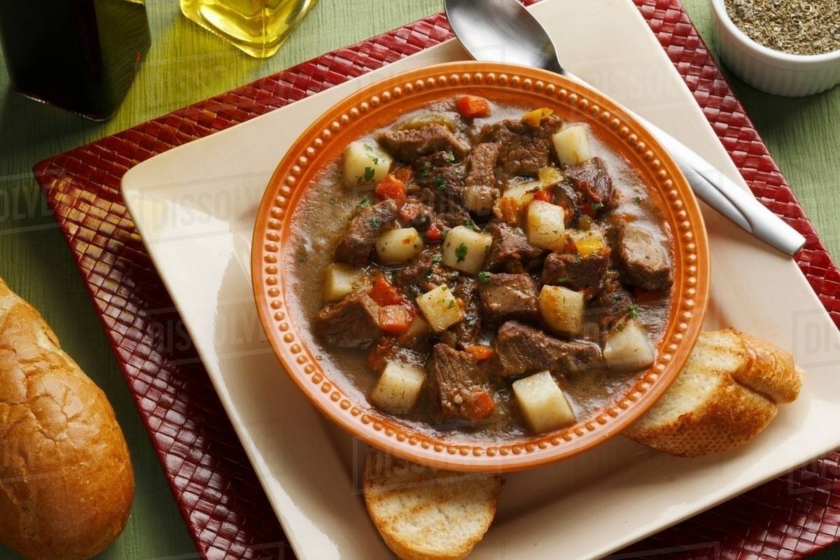 Close up of plate of stew and bread - Royalty-free Stock Photo | Dissolve