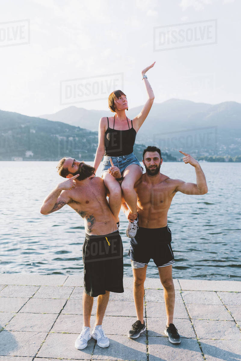 Portrait of three young hipsters posing at lake Como, Como, Lombardy ...