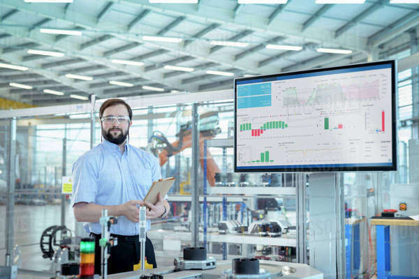 Portrait of robot engineer in robotics research facility - Stock Photo ...