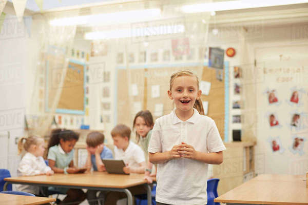 Portrait of schoolgirl in classroom lesson at primary school - Royalty ...
