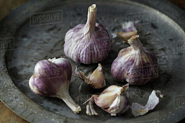 Garlic bulbs on tray - Royalty-free Stock Photo | Dissolve