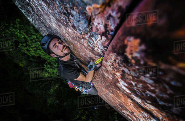Rock climber climbing sandstone rock, elevated view, Liming, Yunnan ...