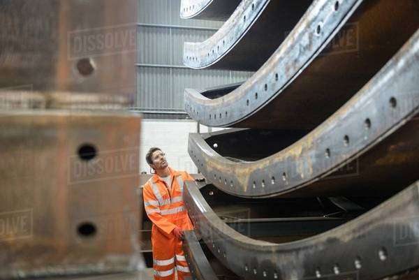 Engineer inspecting marine fabrication used for cable laying - Stock ...