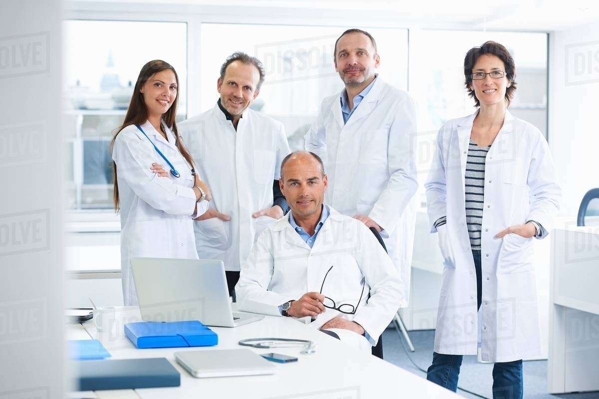 Doctors posing for group portrait - Stock Photo - Dissolve