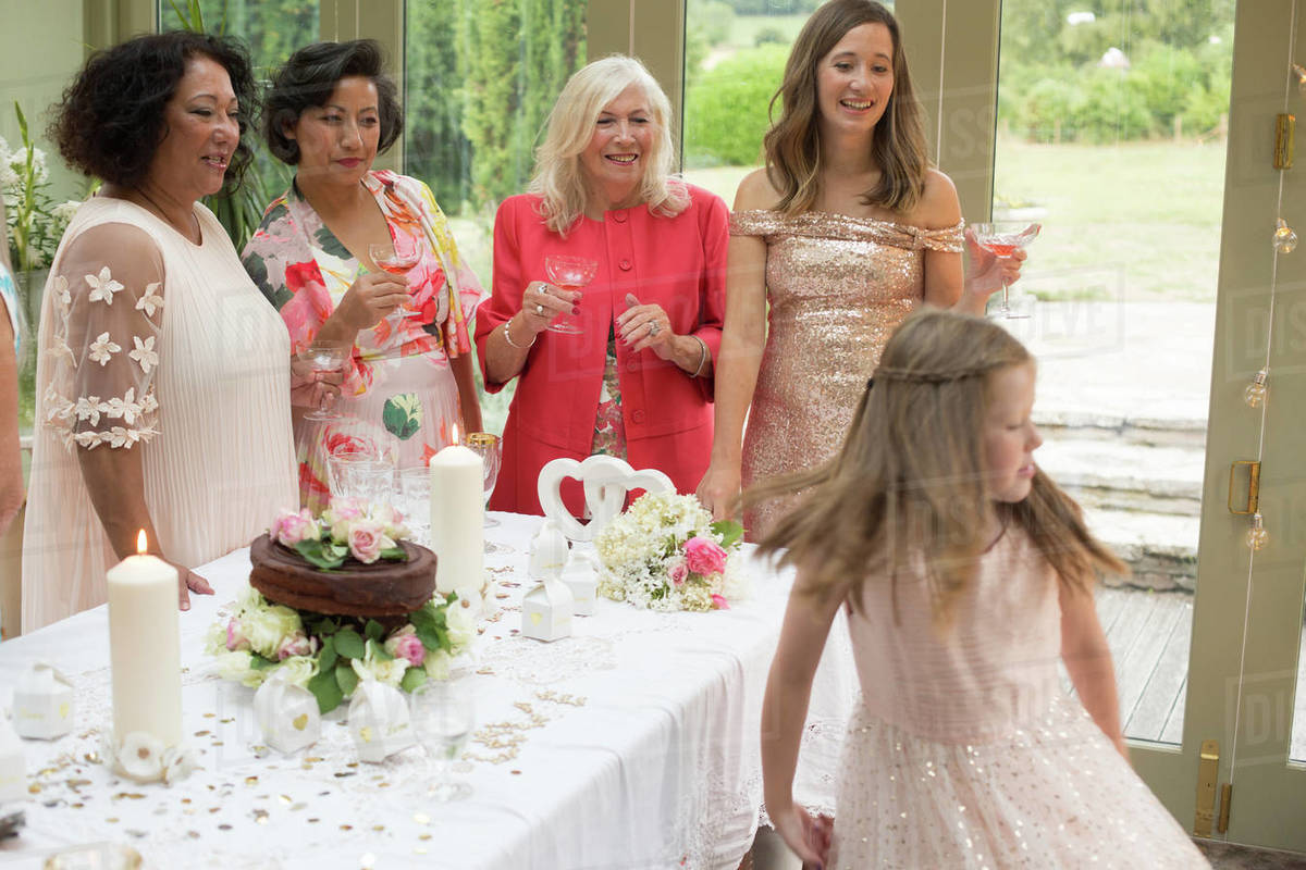 Female wedding guests at reception - Royalty-free Stock Photo | Dissolve