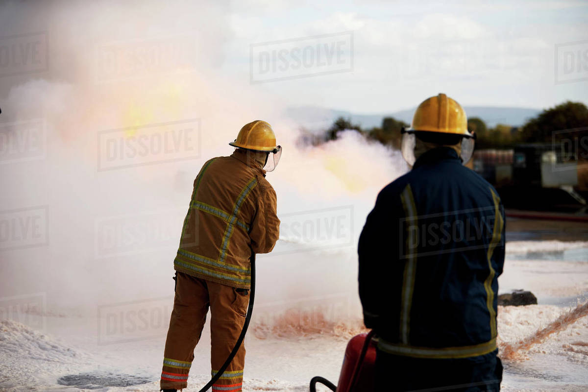 Firemen training, firemen spraying firefighting foam at training ...