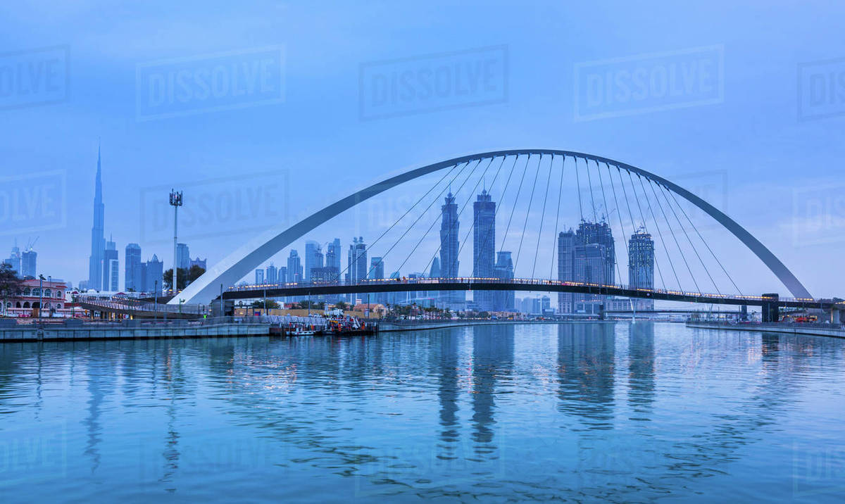 Pedestrian bridge across Dubai Creek, Water Canal Walk, UAE - Stock ...
