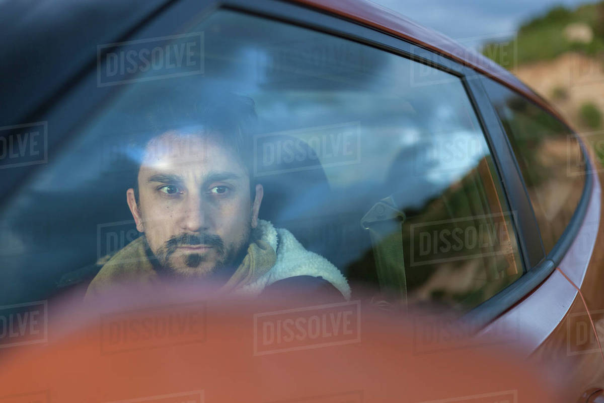 Man behind wheel - Stock Photo - Dissolve