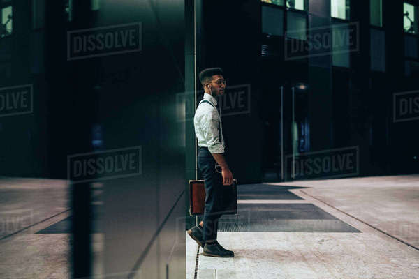 Businessman leaving office building, Milano, Lombardia, Italy - Royalty ...