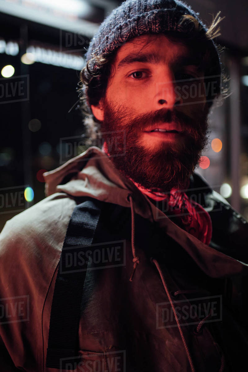 Bearded young man loitering on street - Royalty-free Stock Photo | Dissolve