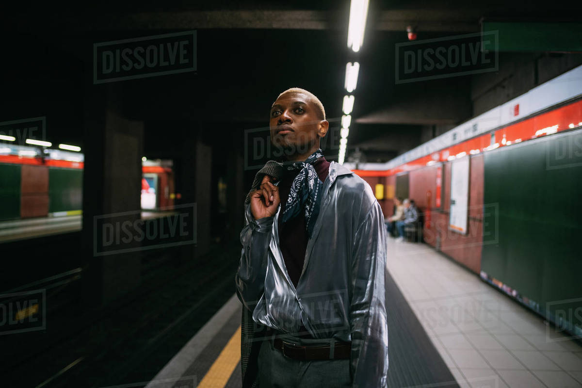 Stylish man on subway platform, Milan, Italy - Royalty-free Stock Photo ...
