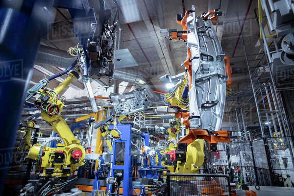 Robots welding car parts on production line in car factory - Stock ...