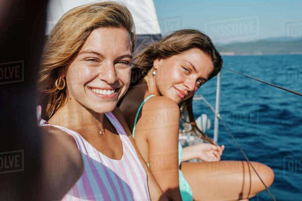 Portrait of friends on sailboat - Royalty-free Stock Photo | Dissolve