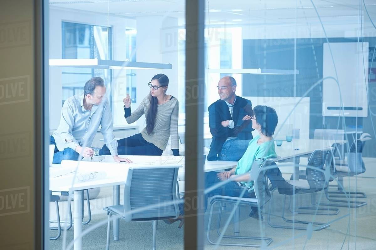 Group of business people having discussion - Stock Photo - Dissolve