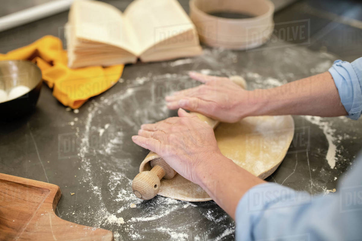 Couple standing in a kitchen, making fresh homemade pasta. - Royalty ...