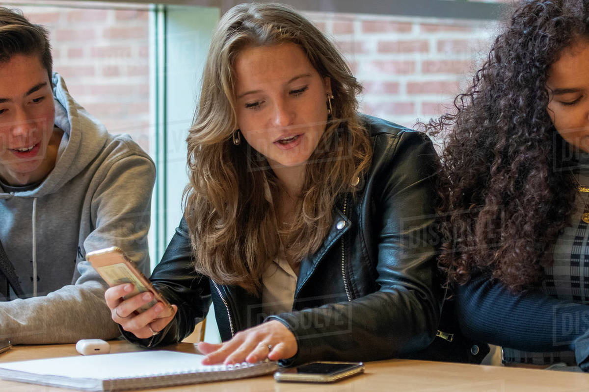 Group of students working on homework - Royalty-free Stock Photo | Dissolve