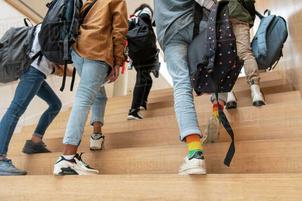 Teenage students walking through the school to their next class - Stock ...