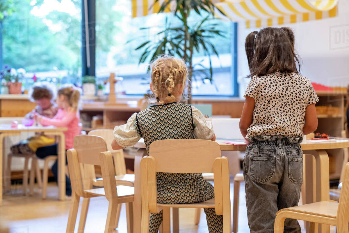 Two children engaged in classroom activities. - Royalty-free Stock ...