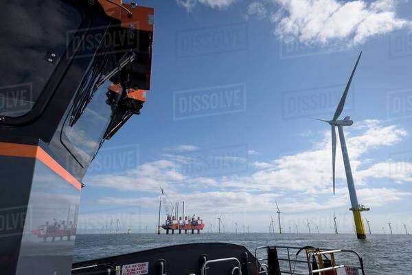 View of offshore wind farm and construction ship from boat - Stock ...