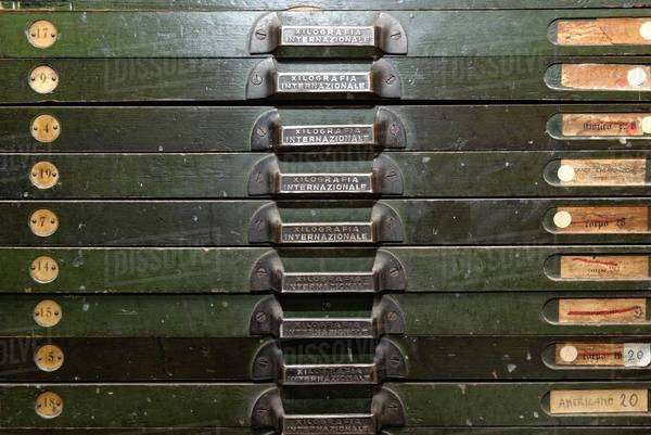 Close up of letterpress drawers in traditional bookbinding workshop ...