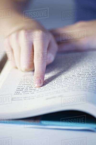Close up of girls finger pointing on reading book - Royalty-free Stock ...