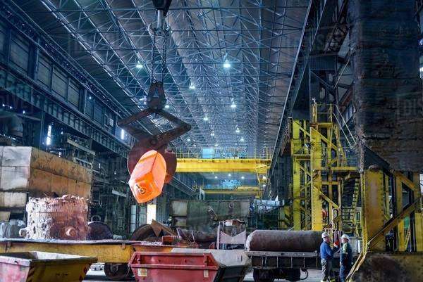 Red hot steel in steelworks - Stock Photo - Dissolve