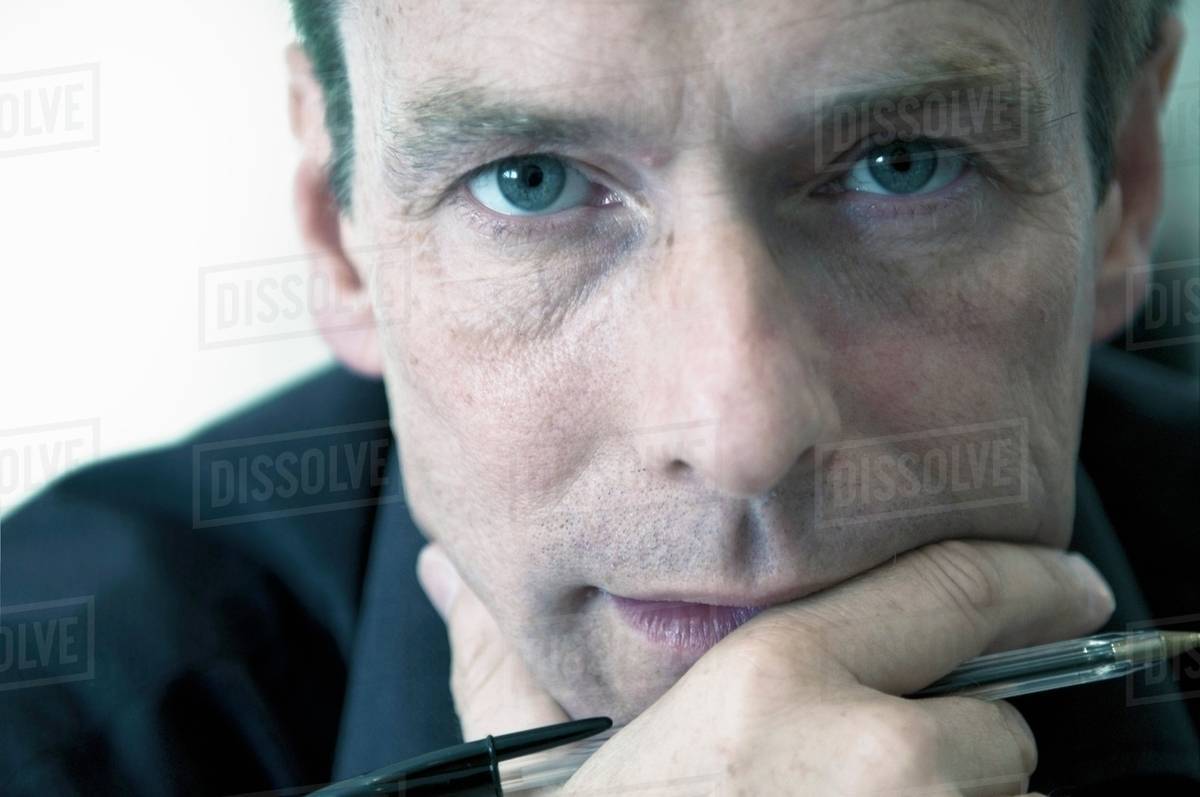 Close up of businessmans serious face - Royalty-free Stock Photo | Dissolve