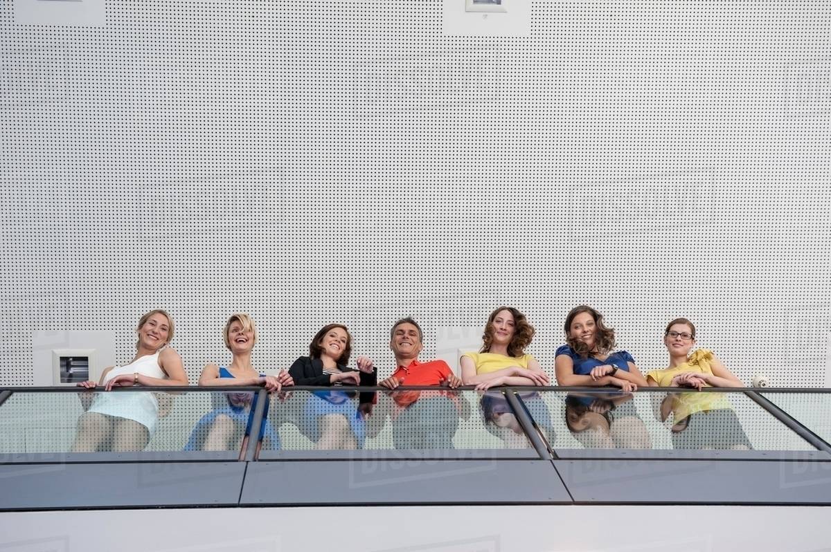Business people standing on balcony - Stock Photo - Dissolve
