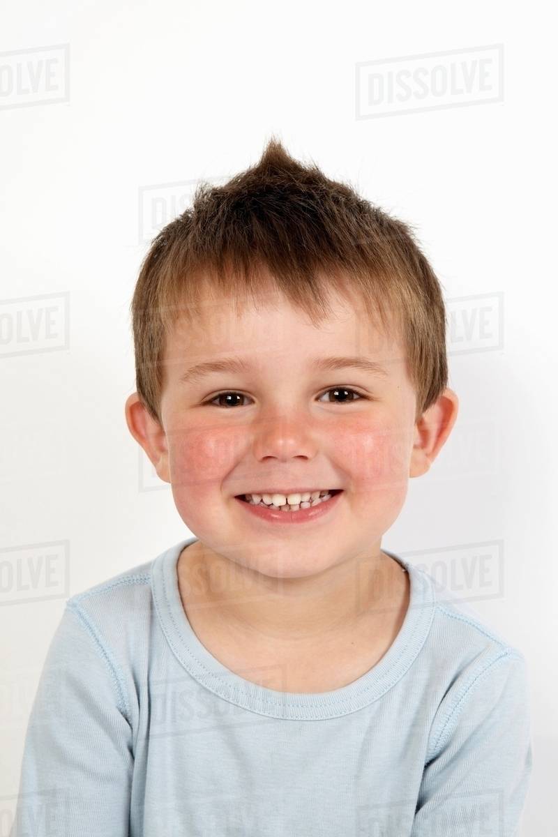 Close up of boys smiling face - Royalty-free Stock Photo | Dissolve