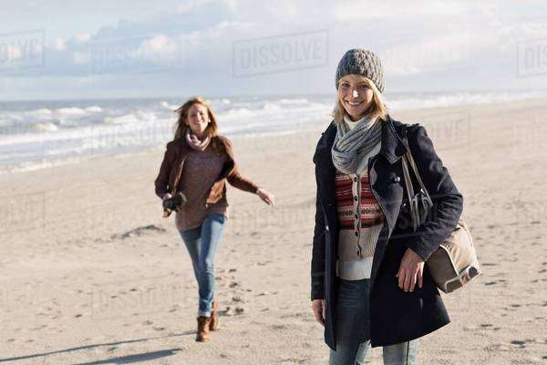 Women walking on beach - Royalty-free Stock Photo | Dissolve