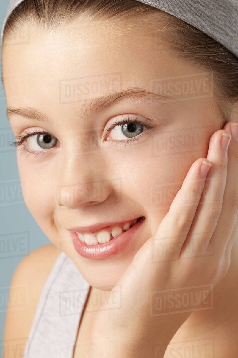 Close up of girls smiling face - Royalty-free Stock Photo | Dissolve