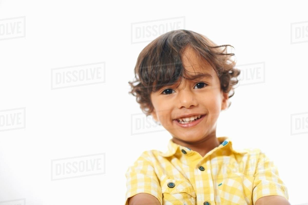 Close up of smiling boys face - Stock Photo - Dissolve