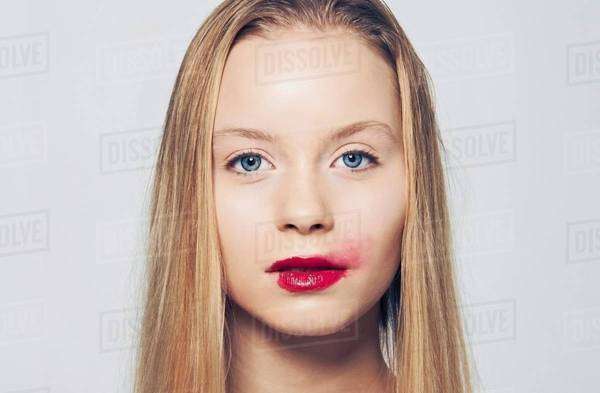 Woman with smeared lipstick - Royalty-free Stock Photo | Dissolve