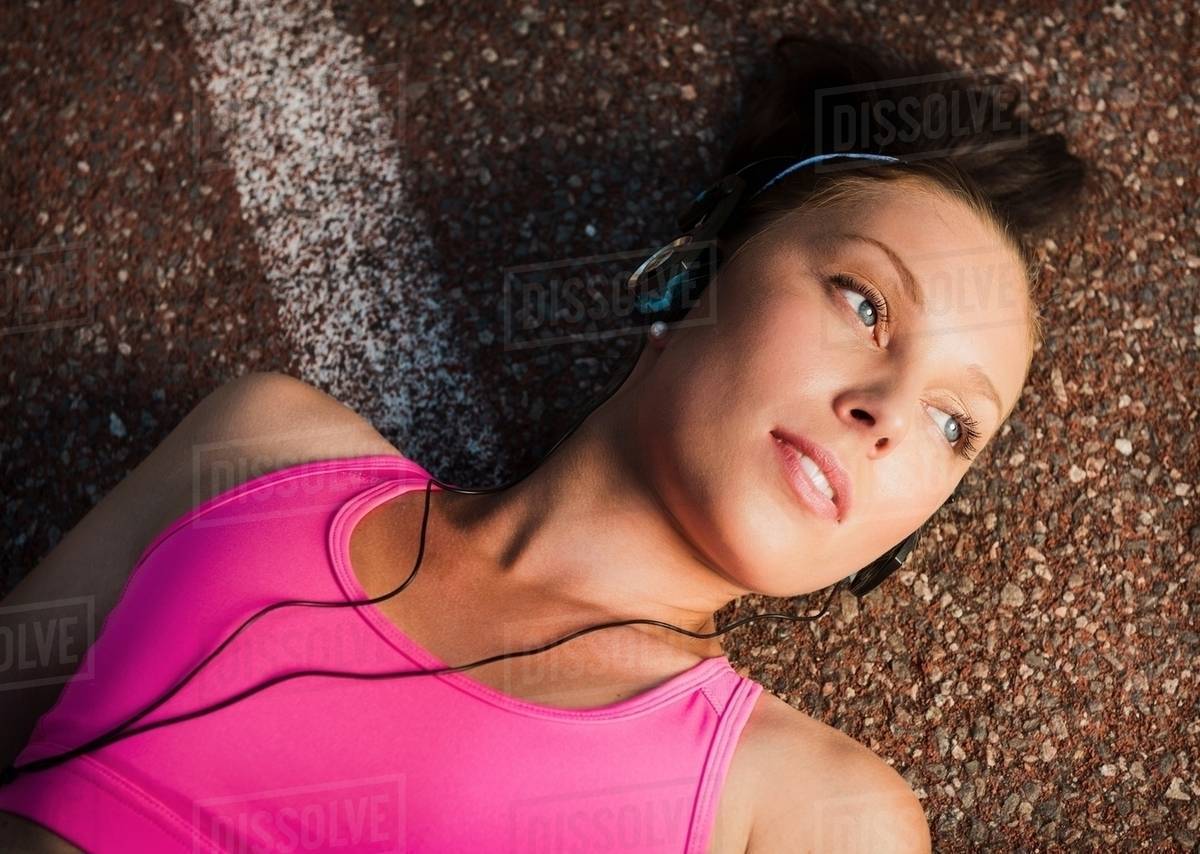 Woman laying on sidewalk - Royalty-free Stock Photo | Dissolve