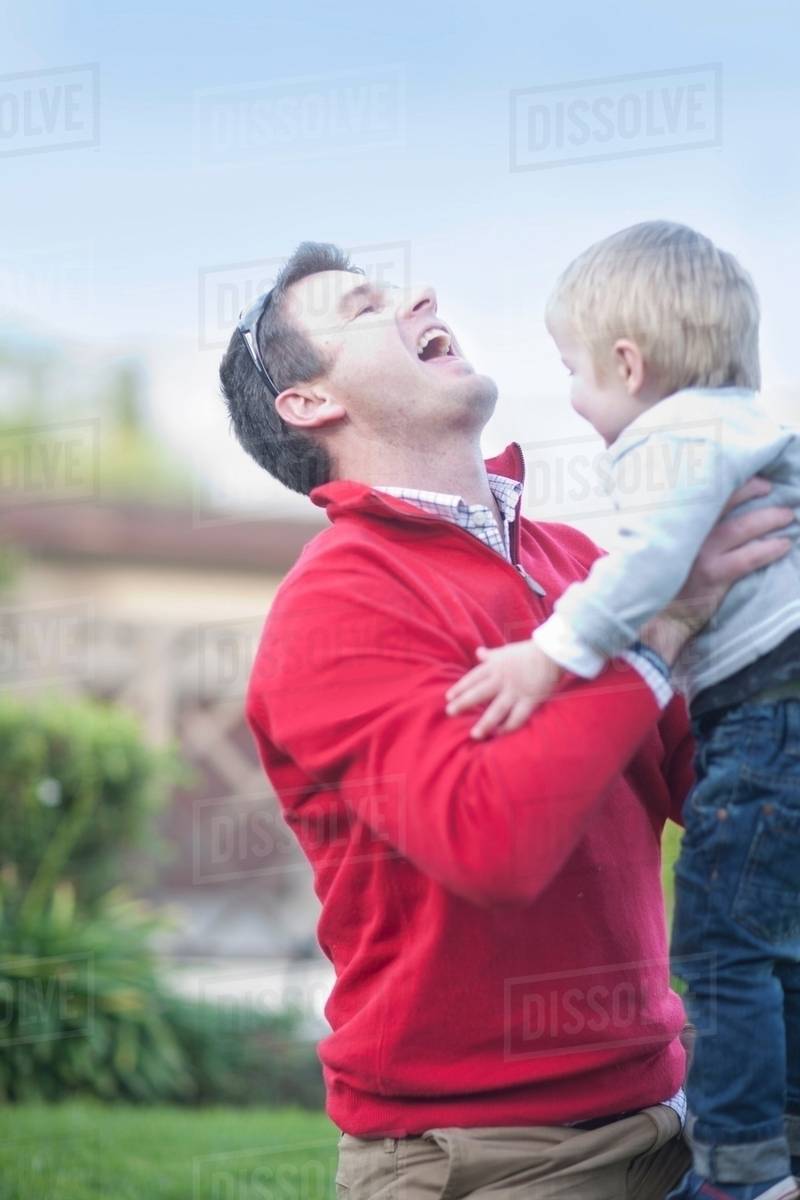 Father lifting toddler - Royalty-free Stock Photo | Dissolve