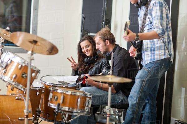 Young musicians looking at sheet music - Royalty-free Stock Photo ...