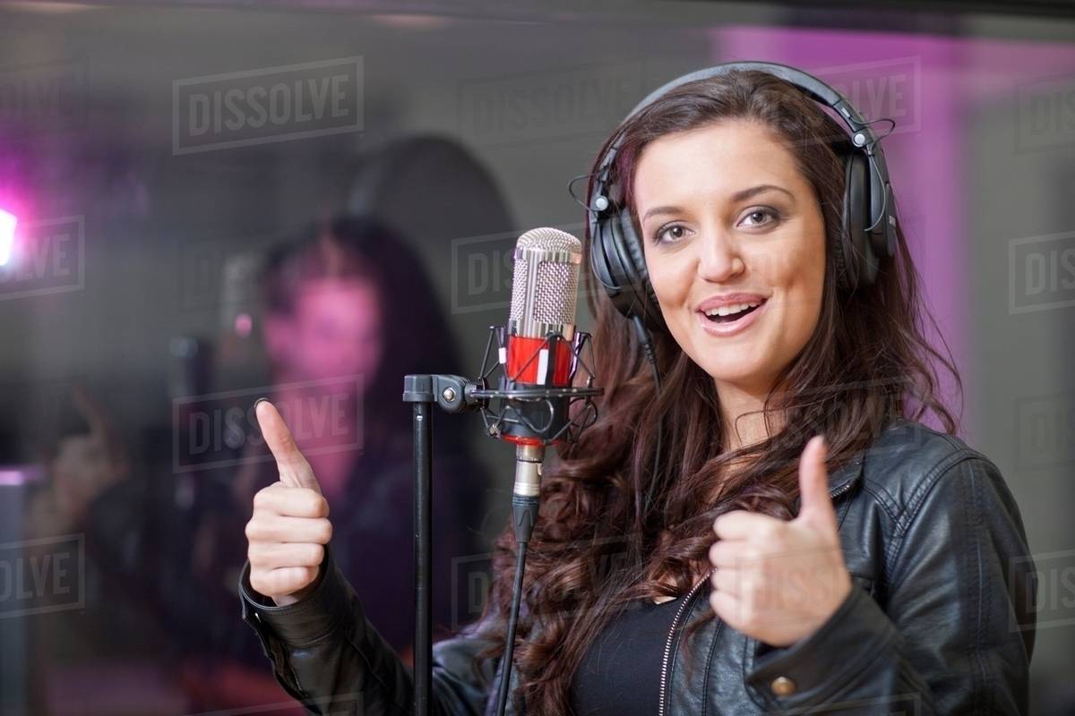 Female singer in recording studio - Royalty-free Stock Photo | Dissolve