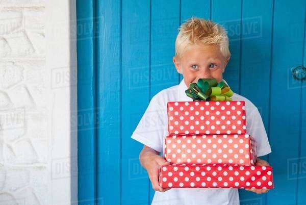 Boy excited at gifts - Royalty-free Stock Photo | Dissolve