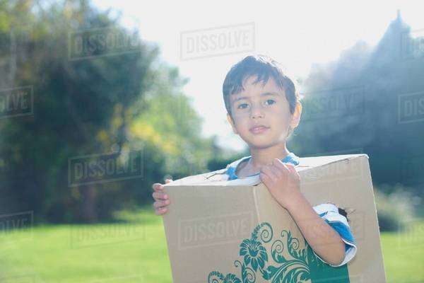 Boy wearing cardboard box - Royalty-free Stock Photo | Dissolve