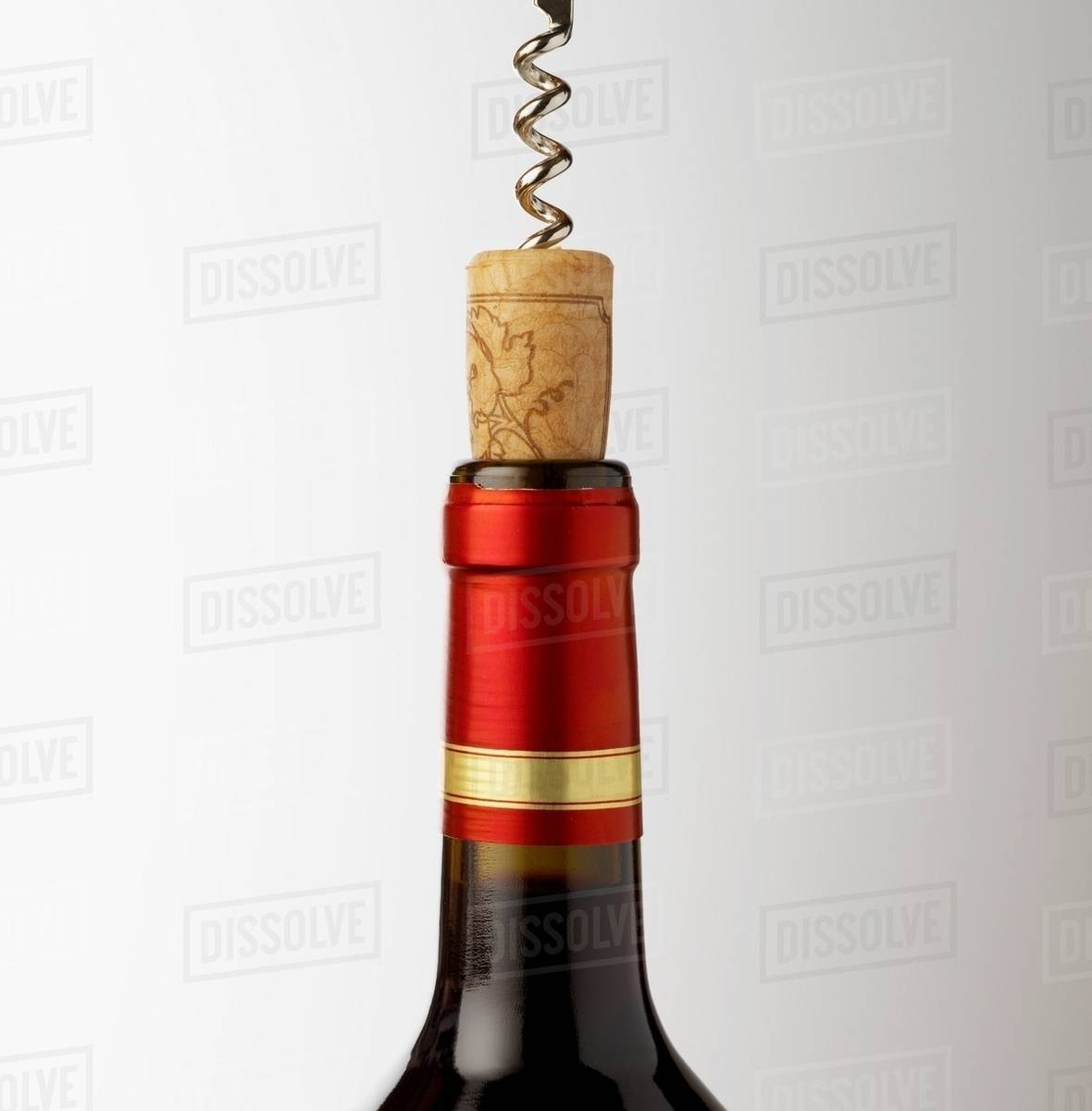 Screw in cork of wine bottle - Stock Photo - Dissolve