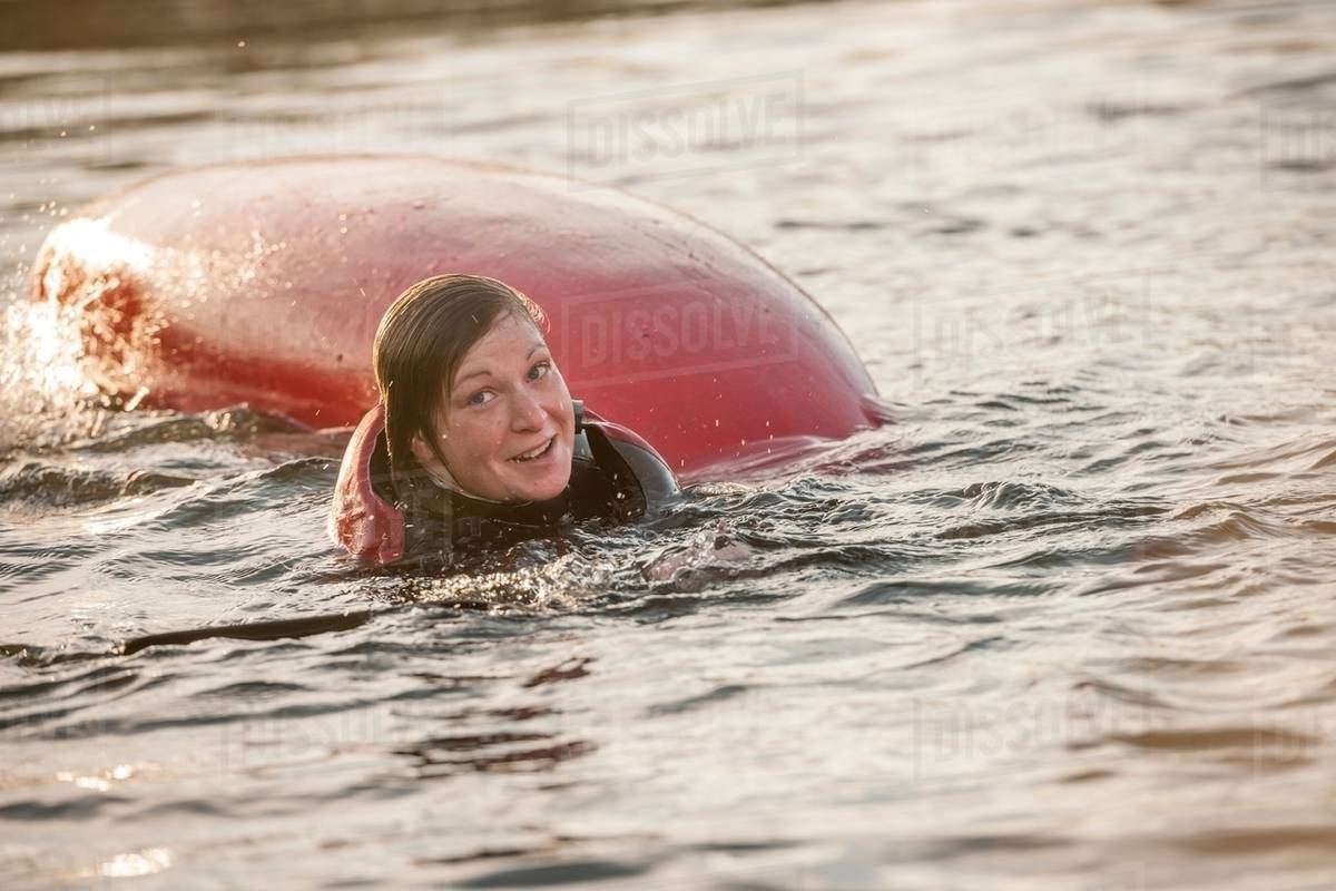 Mid adult woman falling in water with kayak - Royalty-free Stock Photo ...