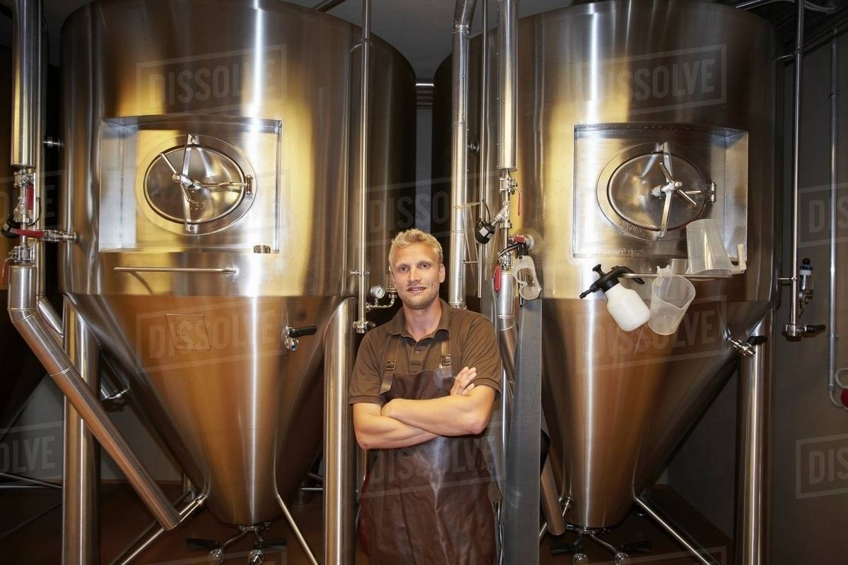 Worker at brewery taking a break - Stock Photo - Dissolve