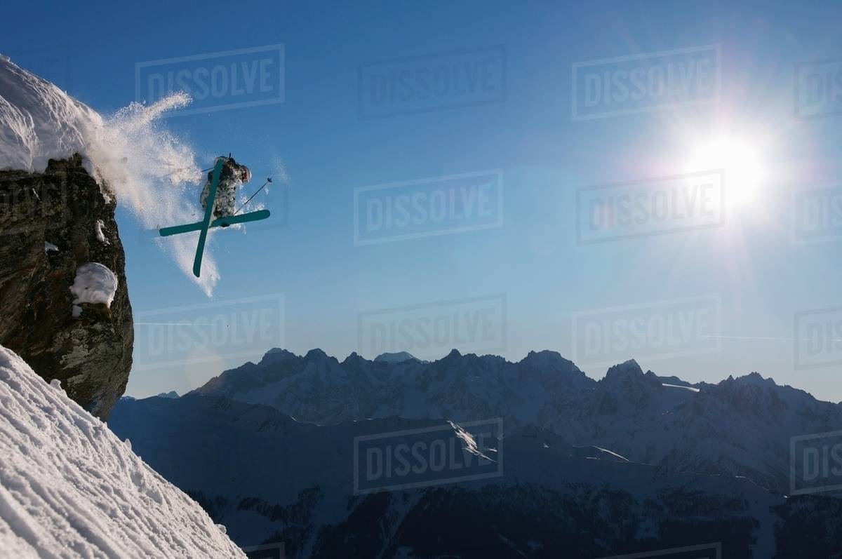 Man skiing off cliff, Verbier, Switzerland - Royalty-free Stock Photo ...