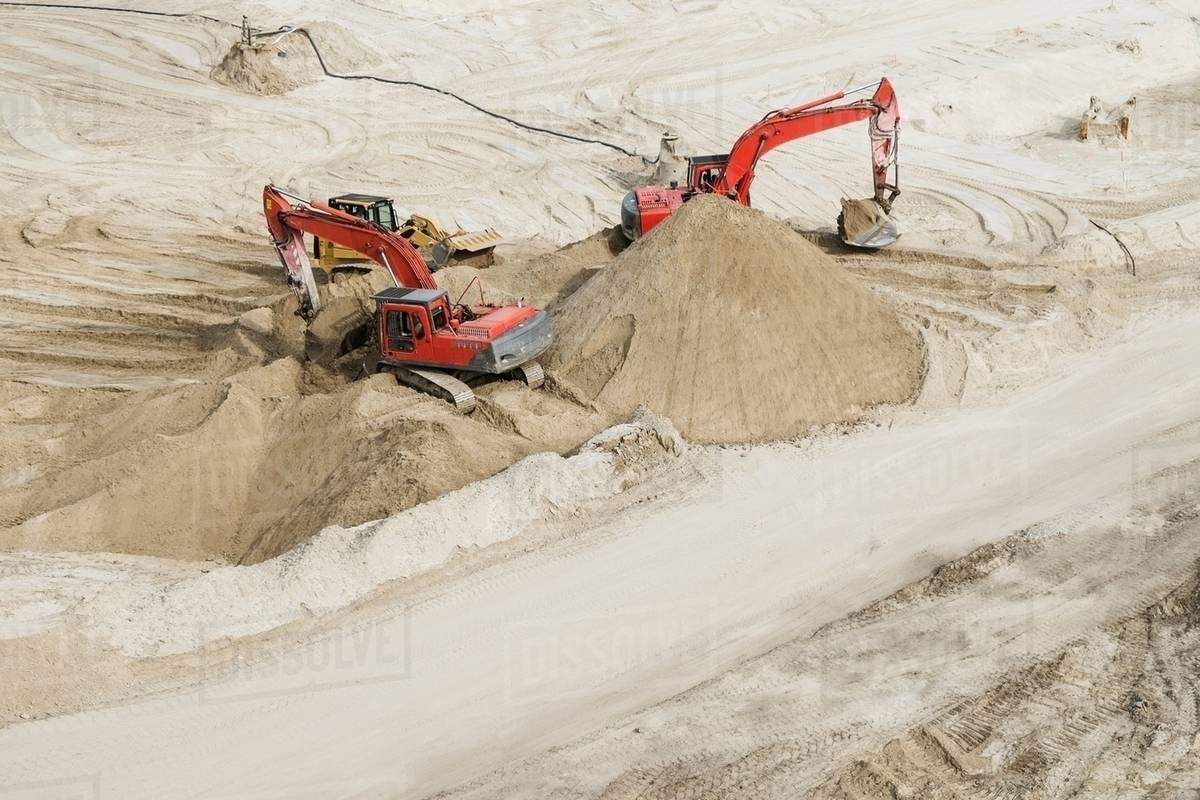 Excavators in sand - Royalty-free Stock Photo | Dissolve