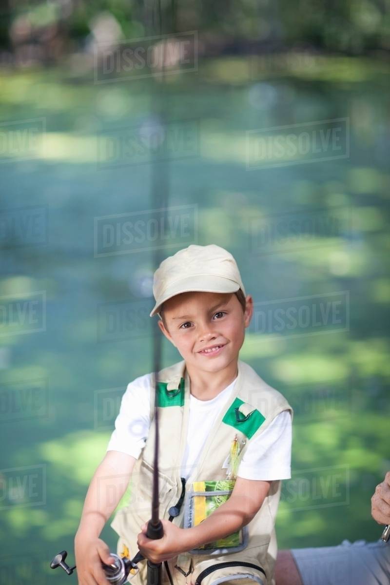 Boy with fishing rod - Royalty-free Stock Photo | Dissolve