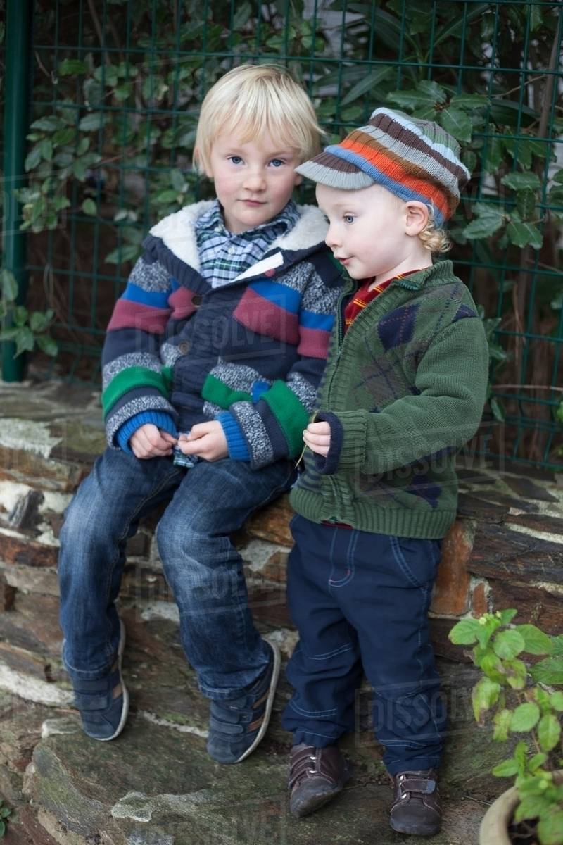 Brothers standing together, outdoors - Royalty-free Stock Photo | Dissolve