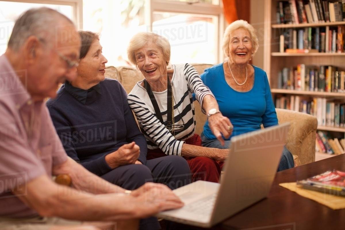 Senior man and female companions in retirement villa - Royalty-free ...