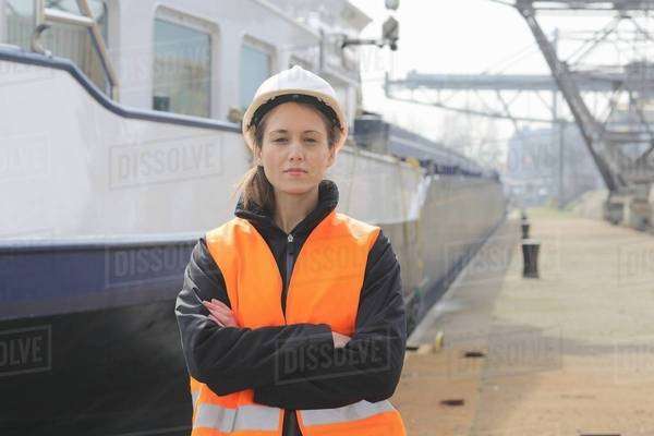 Portrait of female dockworker - Stock Photo - Dissolve