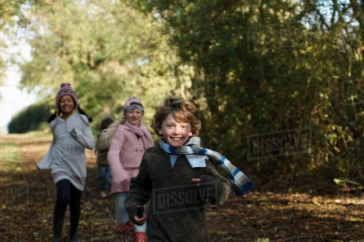 Children running down country lane - Royalty-free Stock Photo | Dissolve