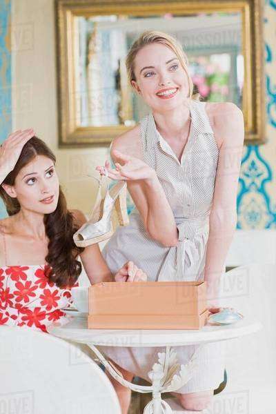 Girls after a successful shopping day - Stock Photo - Dissolve